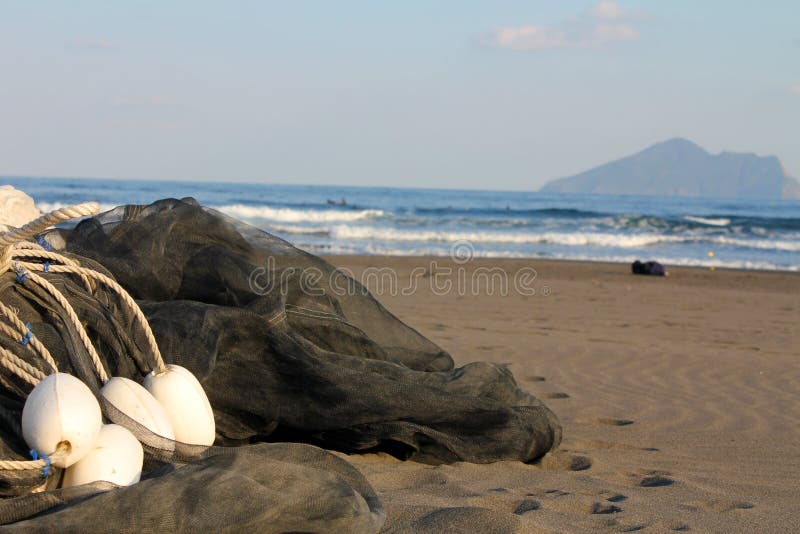 Fishing net on the sand stock photo. Image of seashore - 85093144