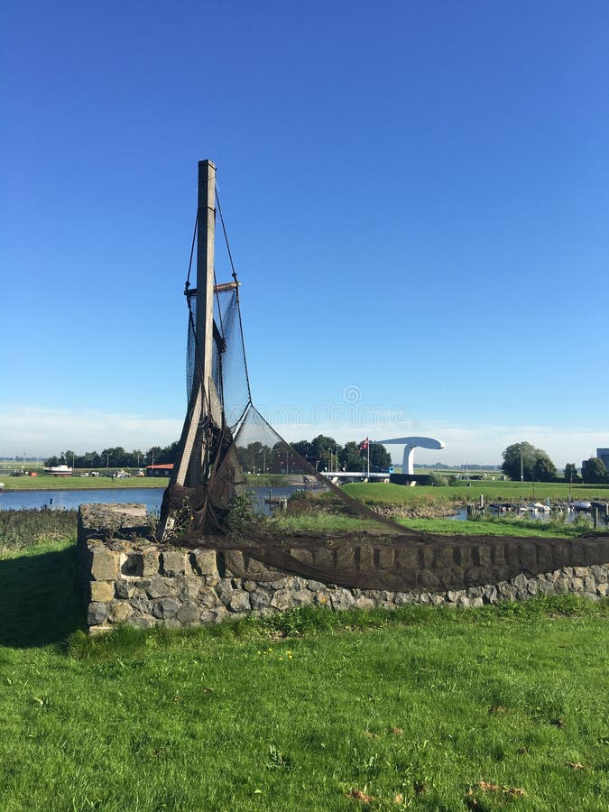 Fishing Net Statue in Vollenhove Stock Photo - Image of river, fishing ...