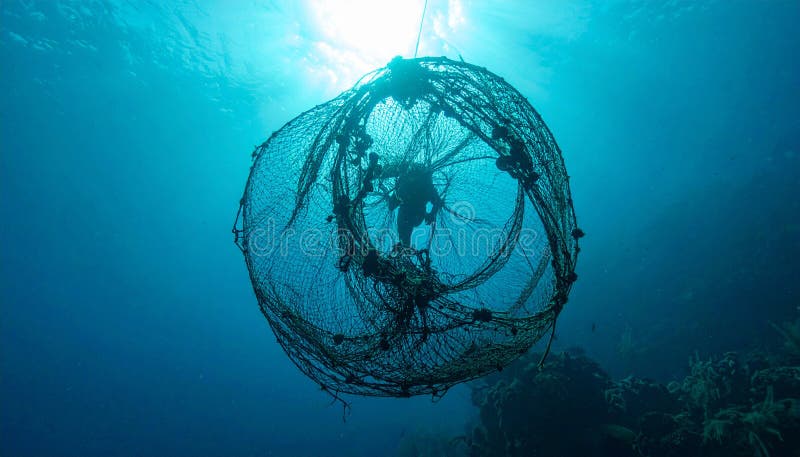 Fishing Net Tangled into a Galaxy Shape, in Deep Blue Water. Plastic ...