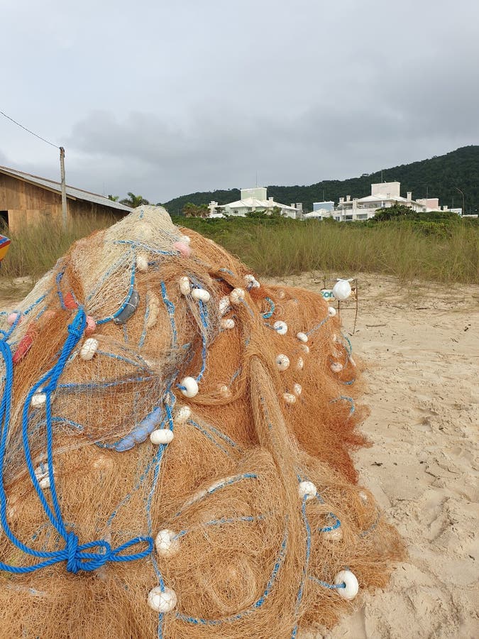 Fishing nets on the beach stock photo. Image of geology - 345926646