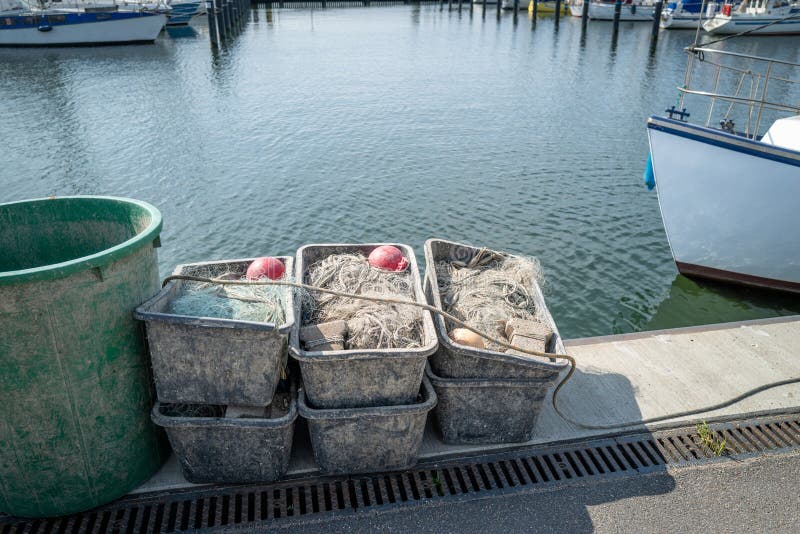 Fishing Nets are in Containers Next To the Fishing Boat Stock Photo ...