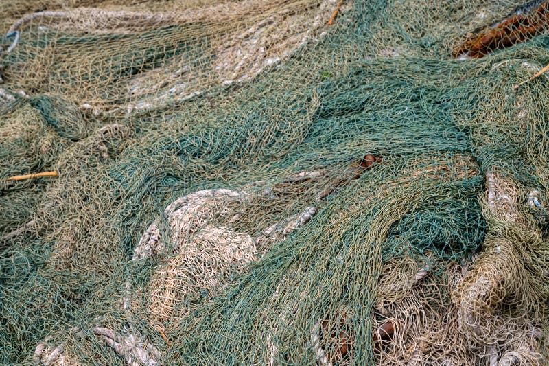 Fishing Nets on the Ground. Big Green Fishing Net Stock Photo - Image ...
