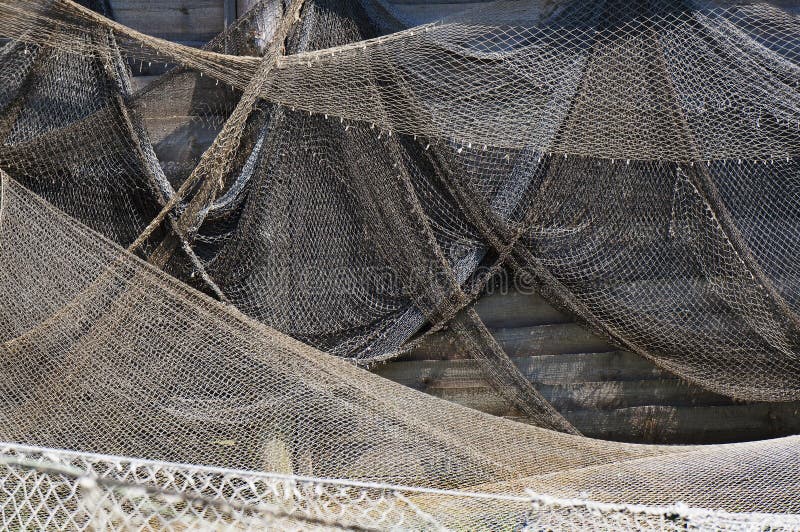 Fishing Nets Hanging on a Wooden Wall Stock Image - Image of color ...