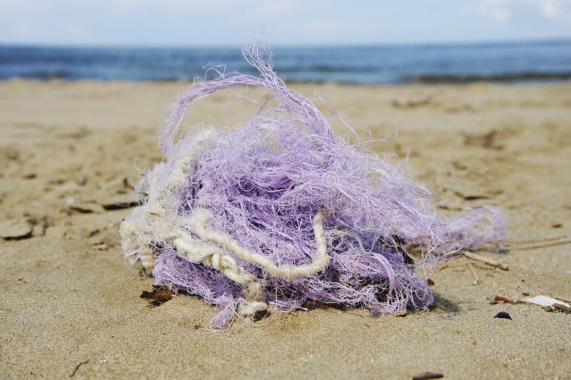 Fishing Nylon Net on the Sand. Garbage on the Beach. Dirty Sea Shore ...