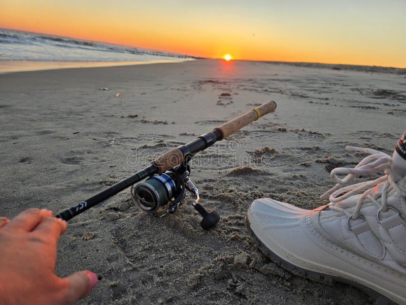 Fishing at the Oceanside Fish Rod at the Sand, Wawes, Skyline Stock ...