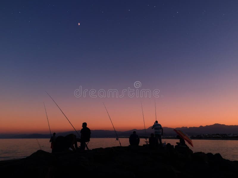 Fishing People at Sunset Under the Sky Stars and Moon Stock Image ...