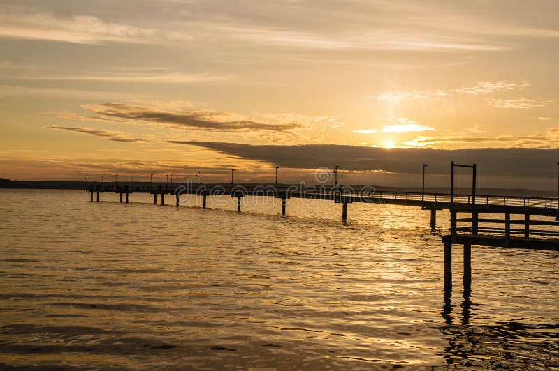 Fishing pier at sunset stock image. Image of moines, serene - 41034457