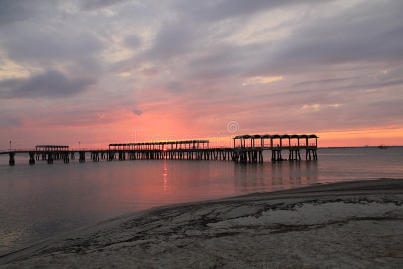 Fishing Pier at Sunset stock image. Image of clouds, water - 44580889