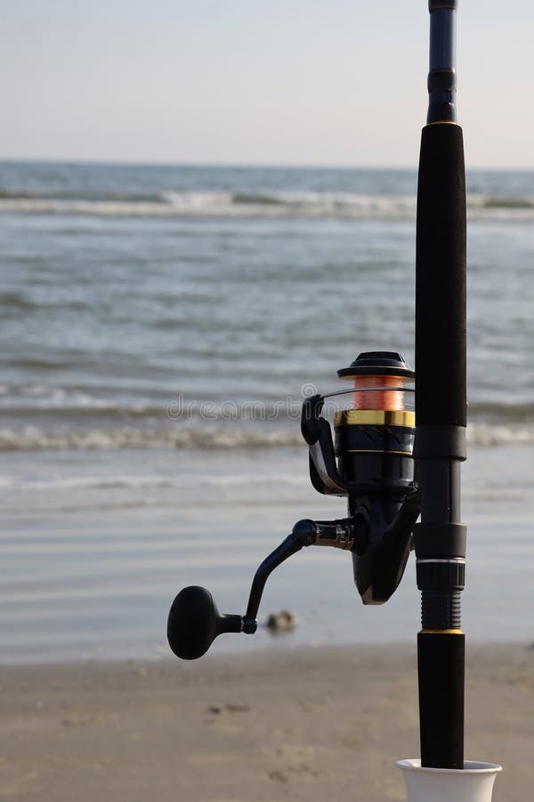 Fishing pole on the beach stock photo. Image of blue - 384757726