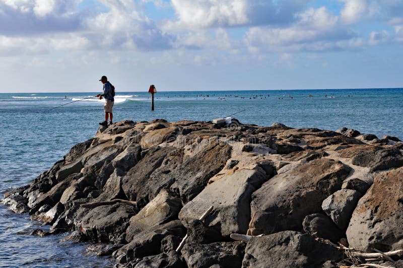 Fishing from the Rocks on the Beach. Editorial Stock Image - Image of ...