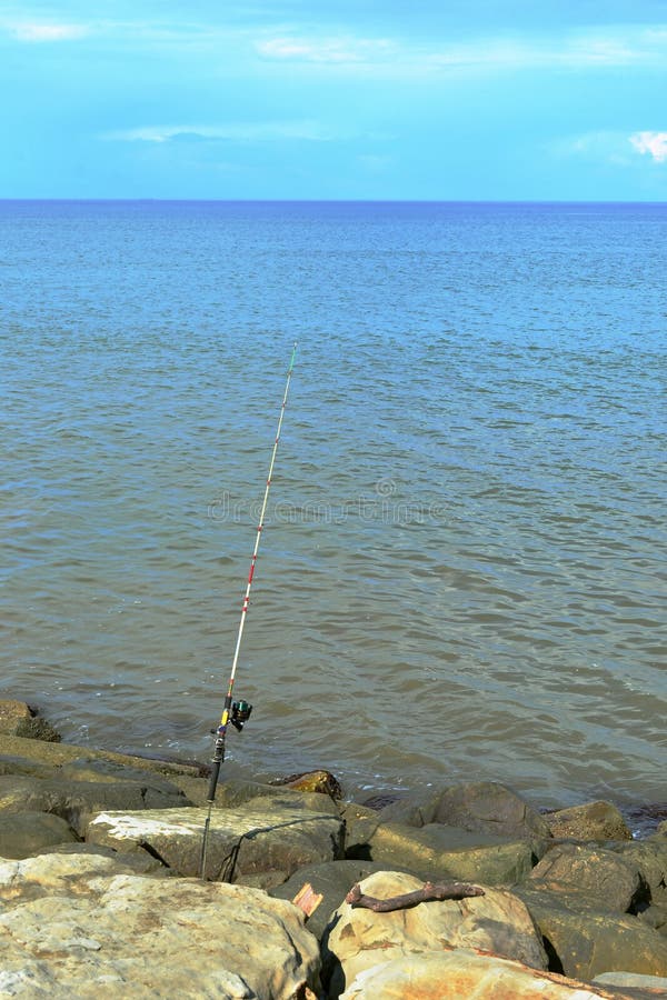 Fishing Rod and Beach stock image. Image of rods, summer - 133185169