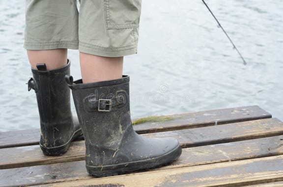 Fishing rod and boots stock photo. Image of child, catch - 28496256