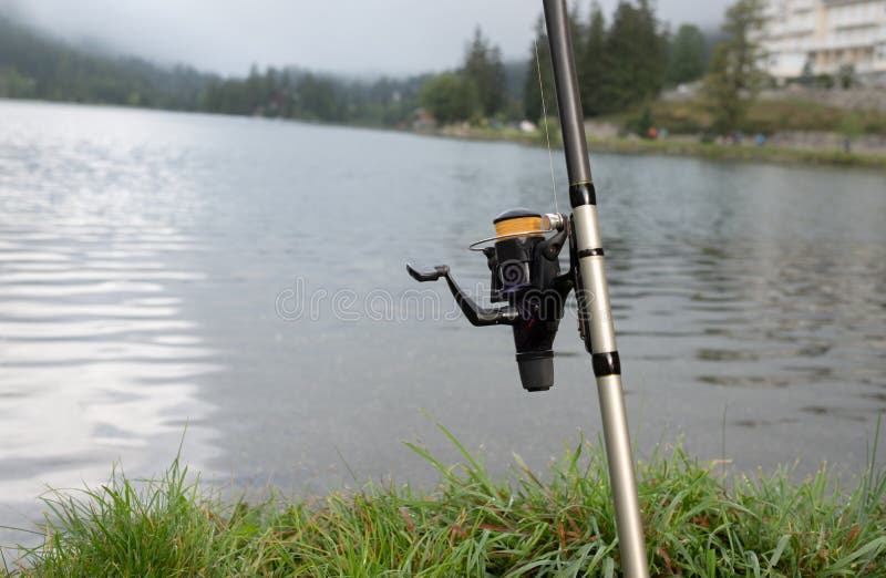 Fishing Rod in Front of a Lake Stock Photo - Image of pole, leisure ...