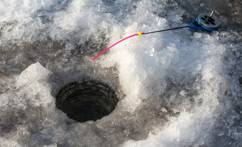 Fishing Rod on Ice in Winter. Ice Fishing Stock Photo - Image of ...