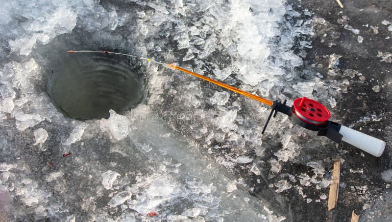 Fishing Rod on Ice in Winter. Ice Fishing Stock Photo - Image of ...