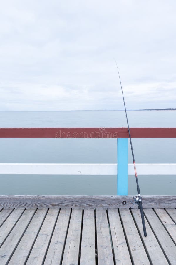 Fishing rod on jetty stock photo. Image of saltwater - 36041428