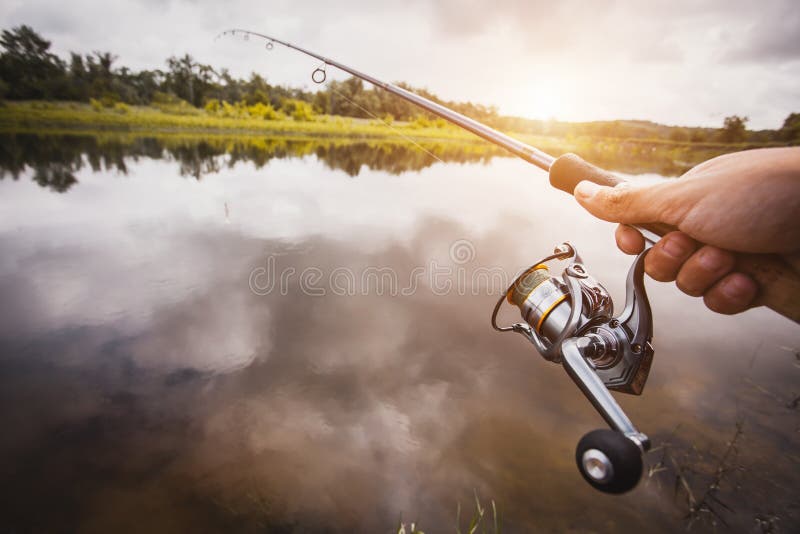 Fishing with rod on lake stock photo. Image of lake, reel - 71914200