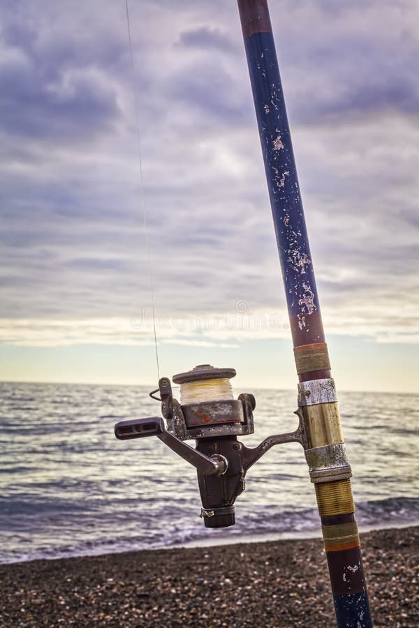 Fishing rod on the ocean stock photo. Image of sport - 135512678