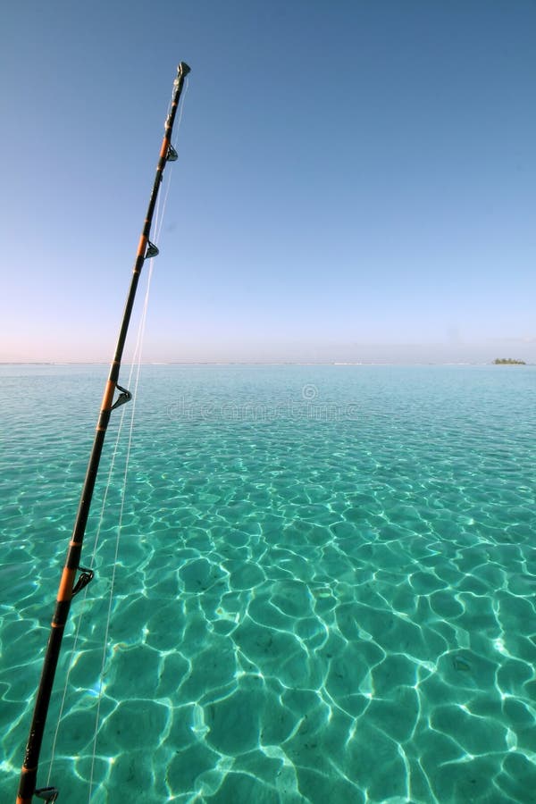 Fishing Rod Over Blue Lagoon Stock Photo - Image of color, bottom: 1217476