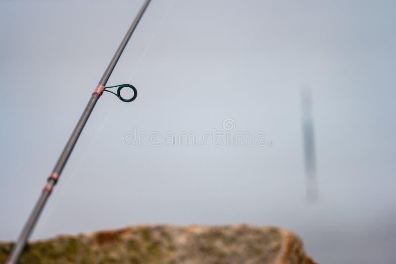 Fishing Rod Resting on a Stone.. Stock Image - Image of fisherman ...