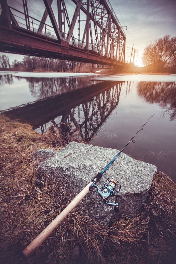 Fishing rod by the river. stock photo. Image of spinner - 67363224