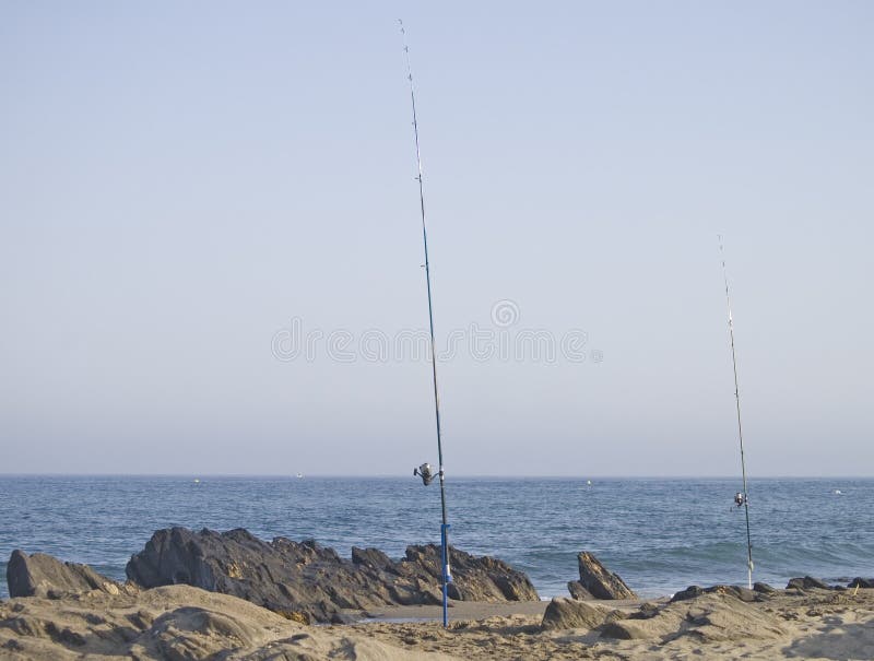 Fishing Rod on the Rocks of the Sea Stock Photo - Image of landscape ...