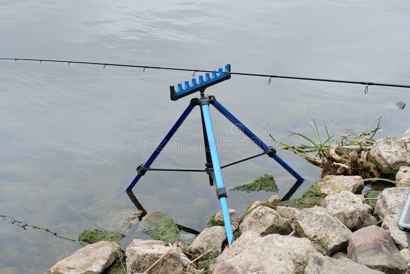 Fishing Rod on a Stand in Front of the Lake River Stock Image - Image ...