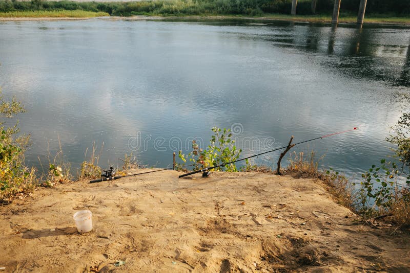 Fishing Rod Standing by the River Stock Photo - Image of fish, nature ...