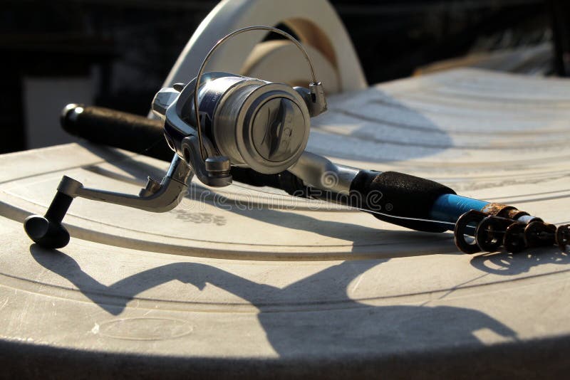 A fishing rod on a sun bed stock photo. Image of landscape - 266625116