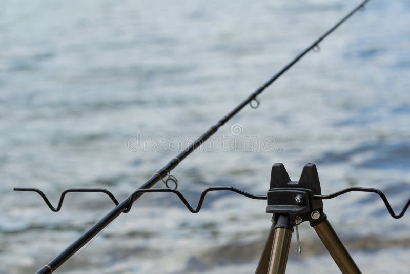 The Fishing Rod on the Tripod in Front of a River. Stock Image - Image ...