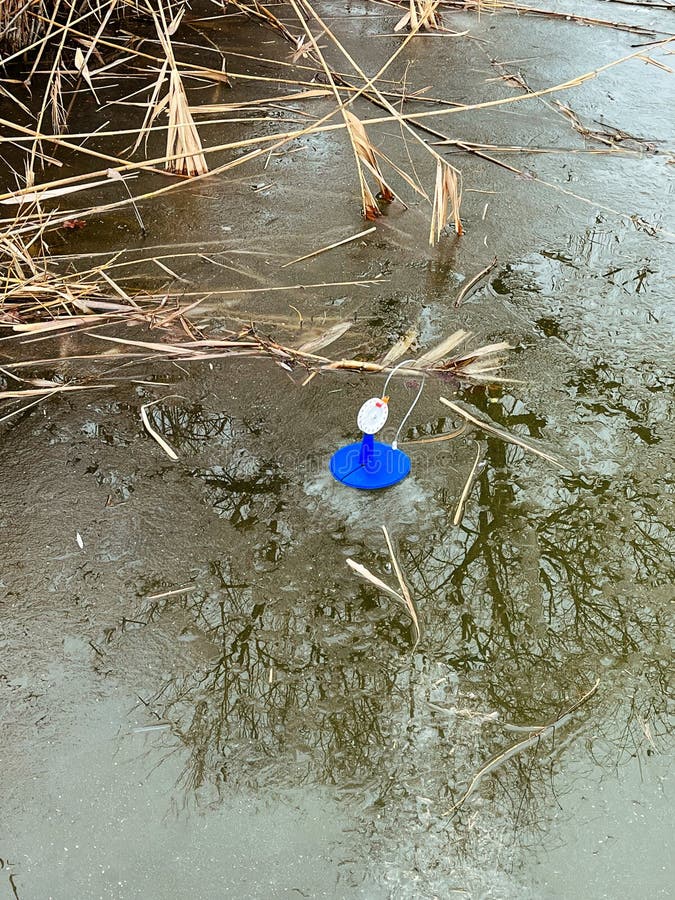 Fishing Rod for Winter Fishing on Snow-covered Ice Surface Stock Photo ...