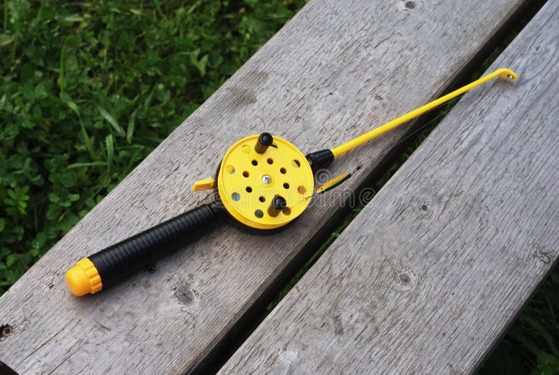 Fishing Rod with Yellow Reel Stock Photo - Image of fishing, leisure ...
