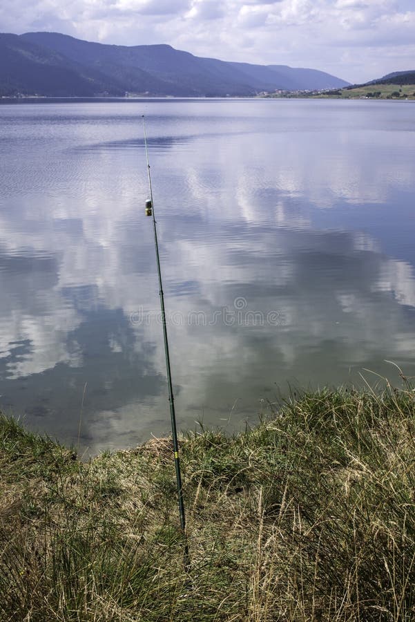 Fishing rods on a lake stock image. Image of summer, line - 45978145