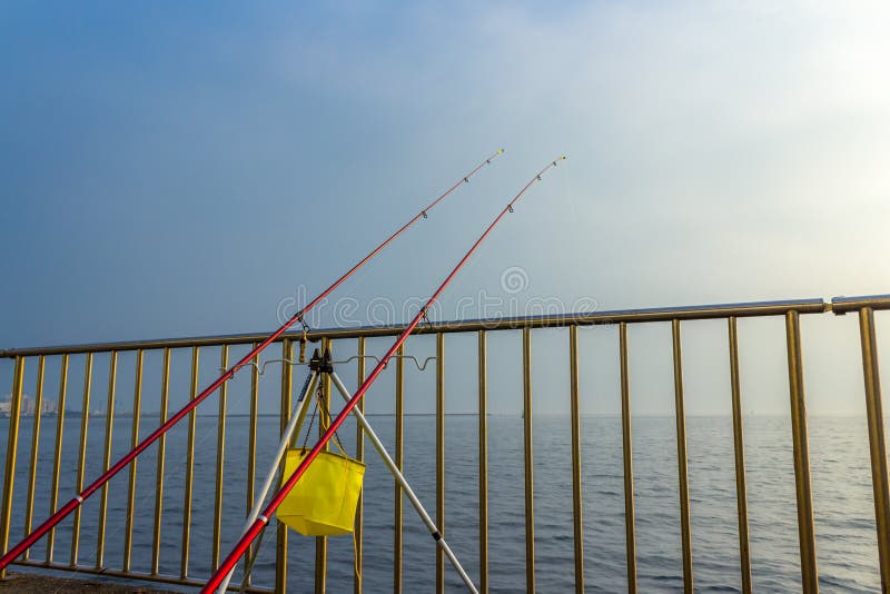 Fishing rods on the water stock photo. Image of outdoor - 164868302