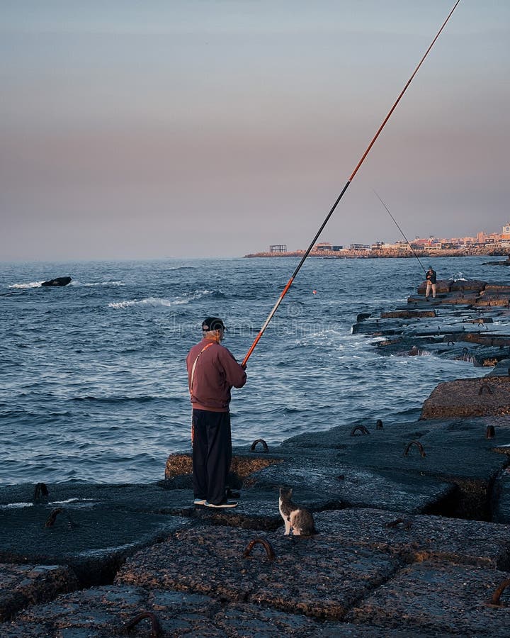 Fishing by the sea editorial stock photo. Image of waves - 302123383