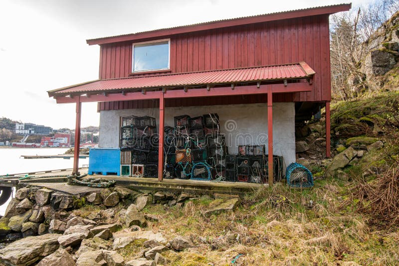 Fishing Shack with Stacked Lobster Traps by Water.. Stock Photo - Image ...