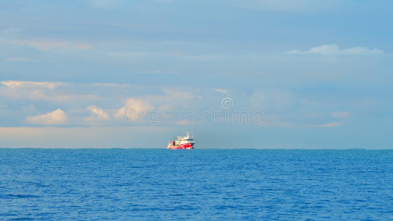 Fishing Ship in Open Sea Water. Beautiful Fishing Boat with the Blue ...