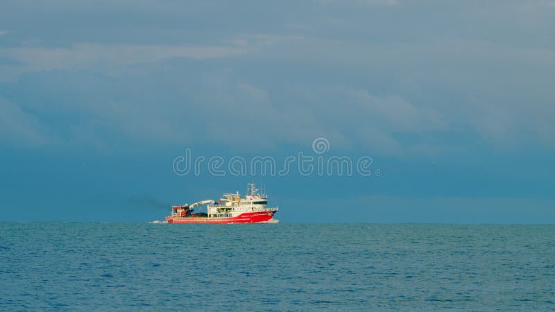 Fishing Ship in Open Sea Water. Beautiful Fishing Boat with the Blue ...