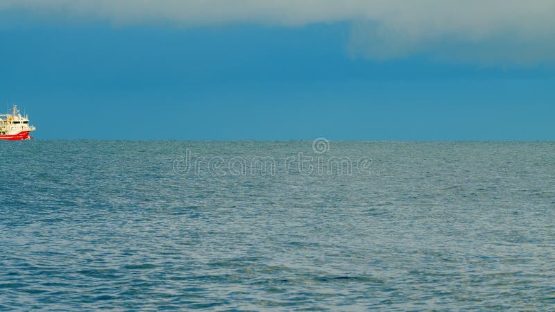 Fishing Ship in Open Sea Water. Beautiful Fishing Boat with the Blue ...