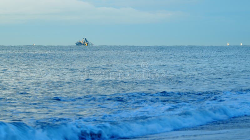 Fishing Ship in Open Sea Water. Beautiful Fishing Boat with the Blue ...