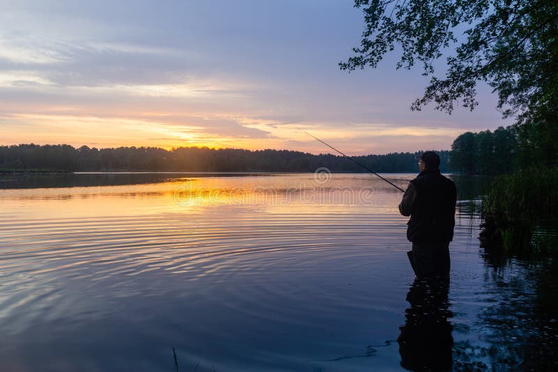 Fishing stock photo. Image of sunrise, gloom, figure - 148173900