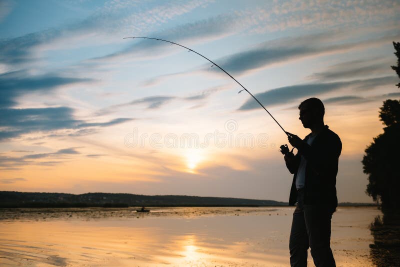 Fishing. Spinning at Sunset Stock Image - Image of fish, water: 273942629