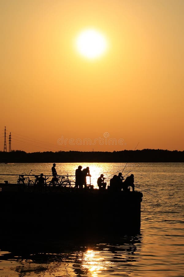 Fishing during the sunset stock photo. Image of casting - 26379644