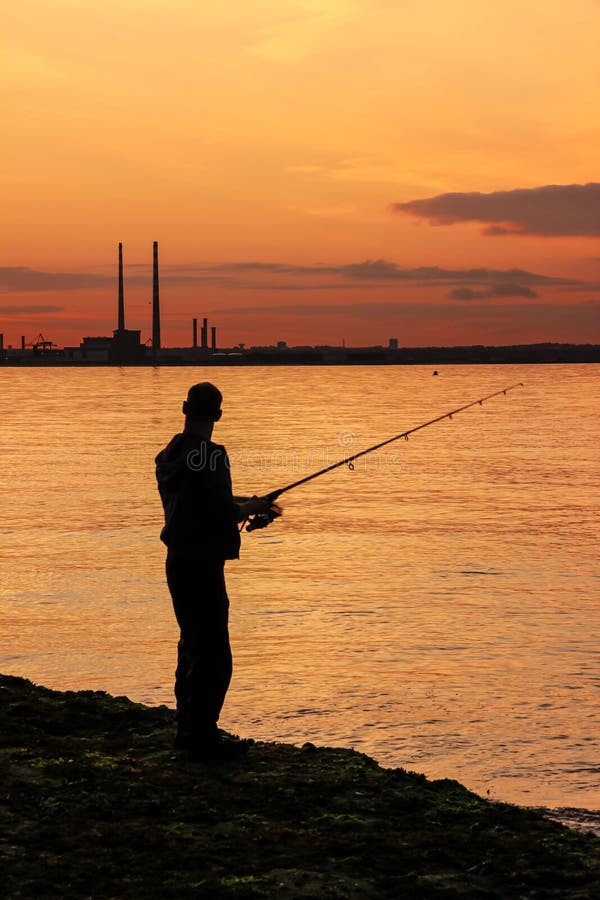 Fishing at sunset. Dublin stock photo. Image of reel - 26959744