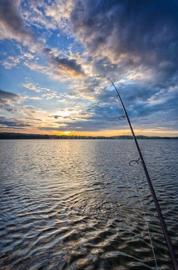 Fishing in sunset scenery stock photo. Image of summer - 73050386