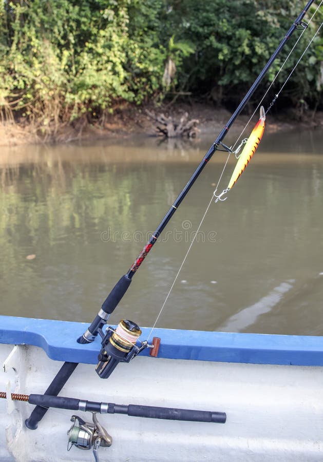 Fishing Tackle Fixed on the Side of the Boat during Fishing Stock Photo ...