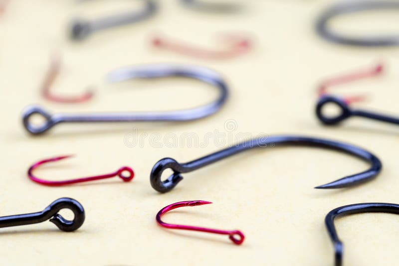 Fishing Tackle Fishing Hooks in Large Quantity on Yellow Surface Stock ...