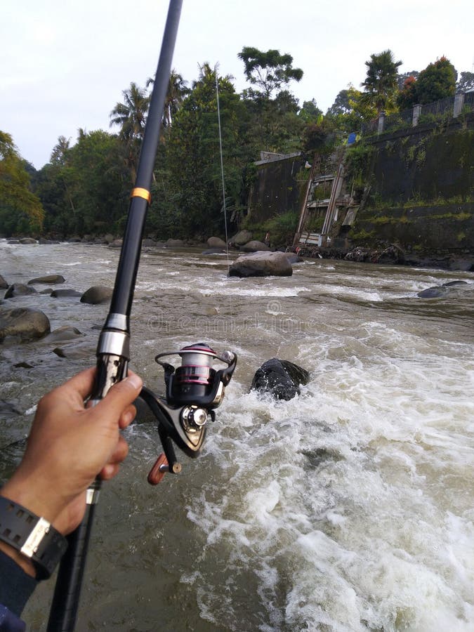 Fishing time in the river stock photo. Image of canoe - 206298472