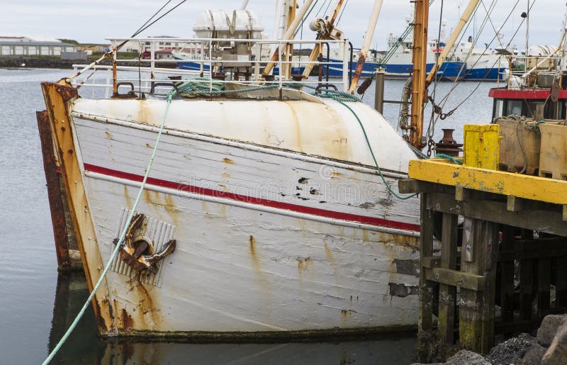 Fishing trawler on pier stock photo. Image of masts - 210115806