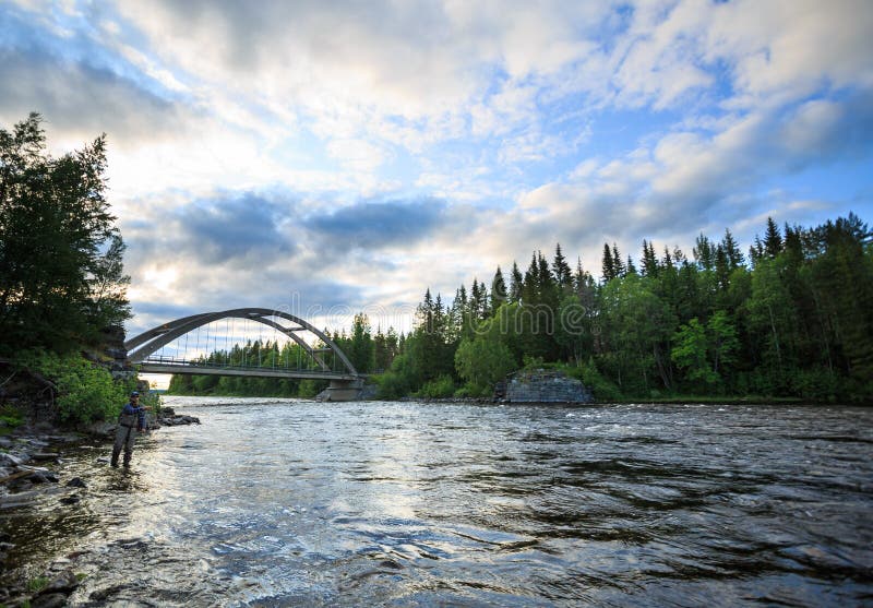 Fishing under the bridge editorial photo. Image of browntrout - 86995761